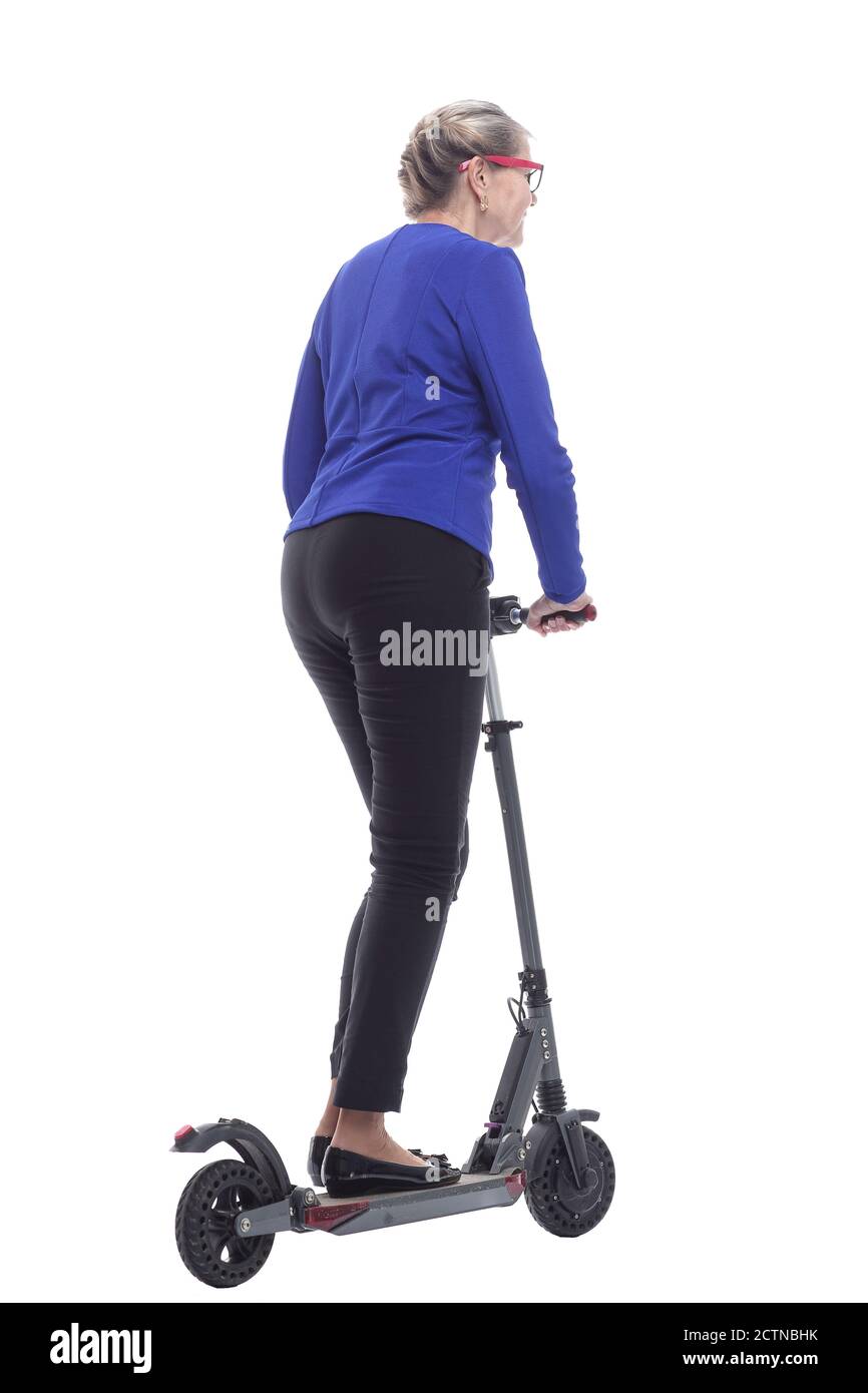 rear view. modern elderly woman moving on an electric scooter Stock ...