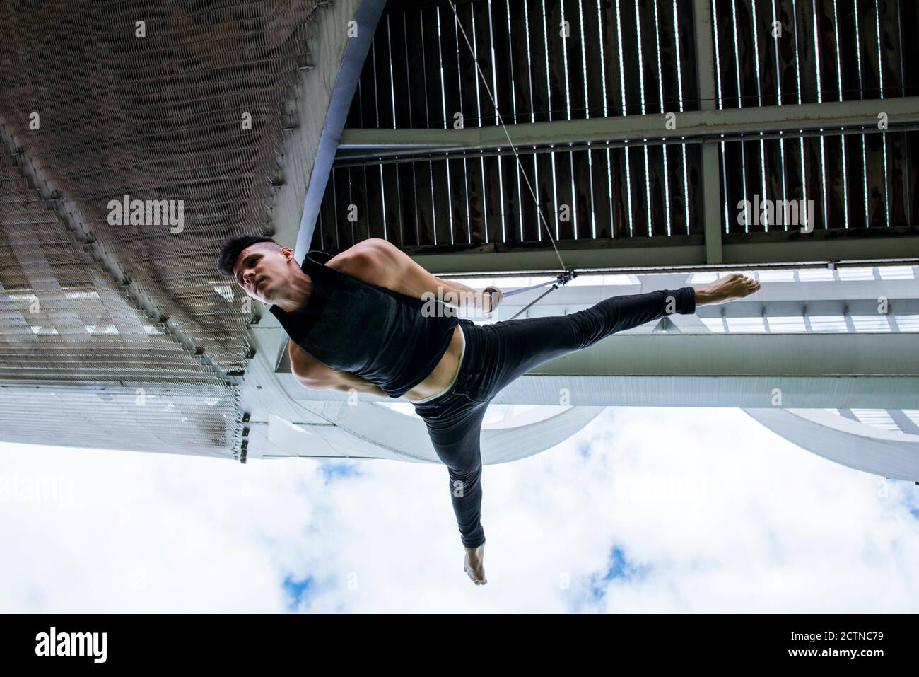 Man hanging upside down from hi-res stock photography and images - Alamy