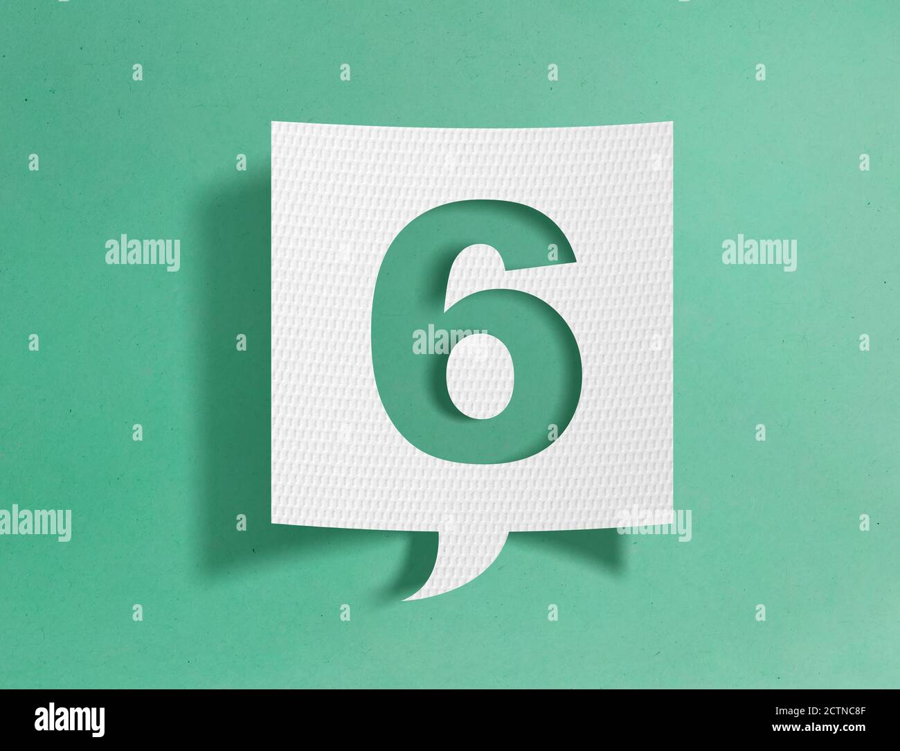 Speech bubble with number 6 on green background Stock Photo - Alamy