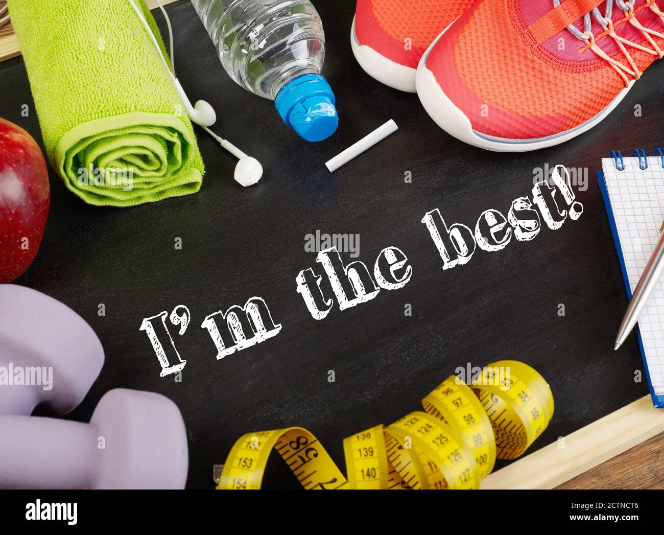 Sport equipment and motivational message on a blackboard Stock Photo ...