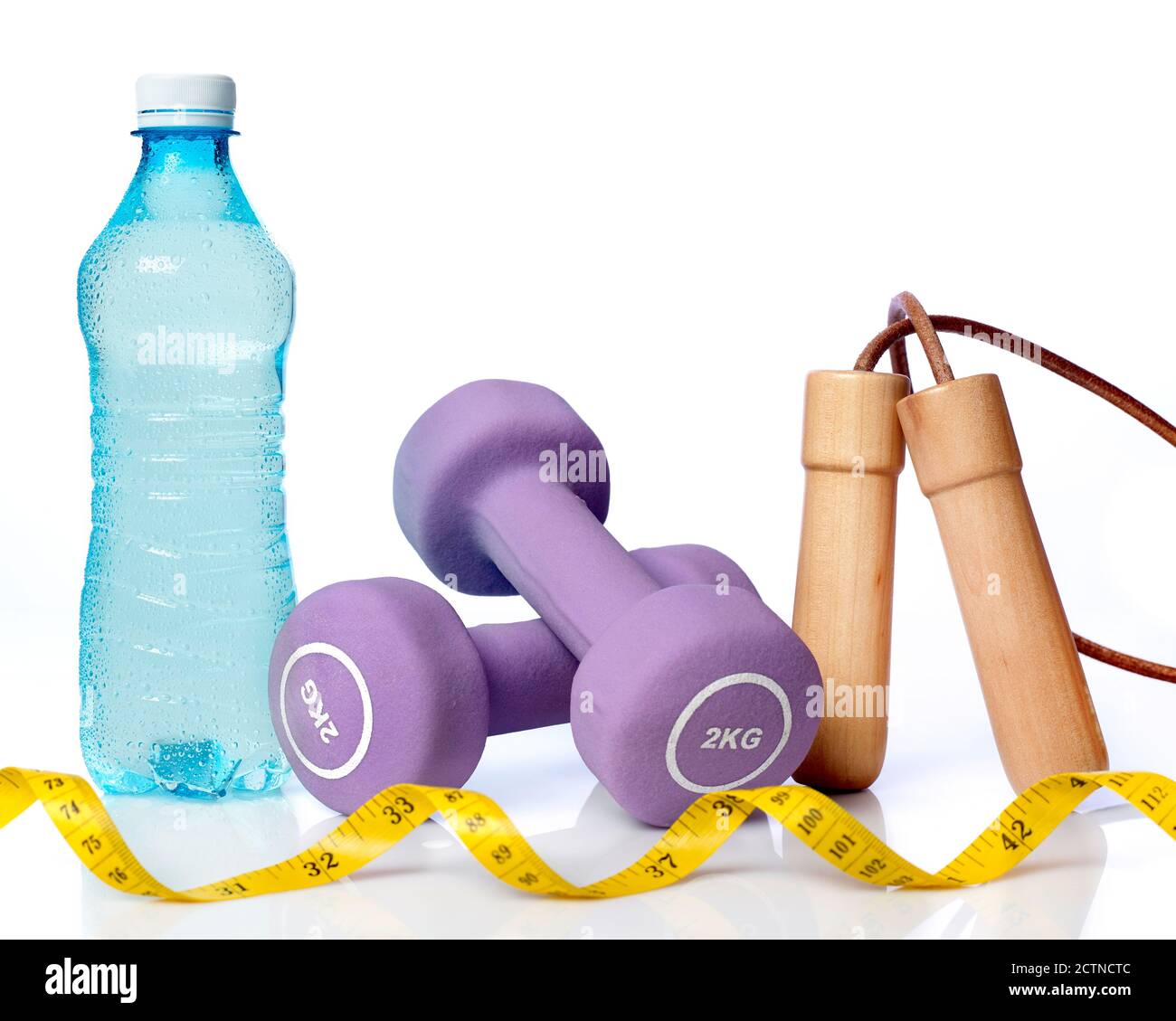 Dumbbells, water bottle and jumping rope Stock Photo - Alamy