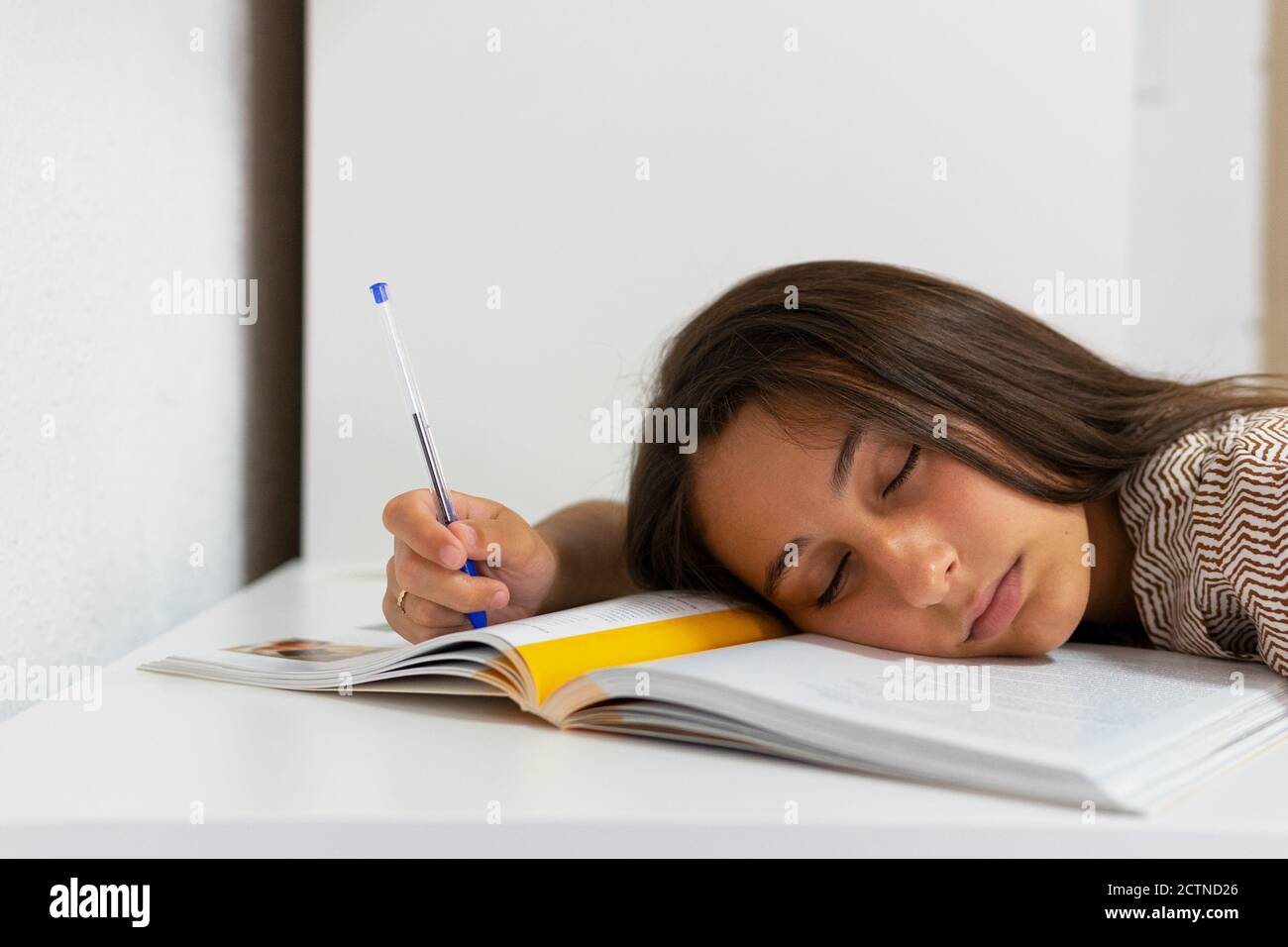 Female lying on desk hi-res stock photography and images - Alamy