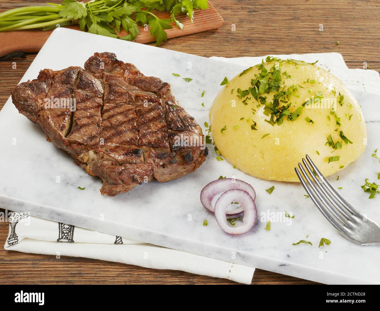 Rustic steak with polenta Stock Photo - Alamy
