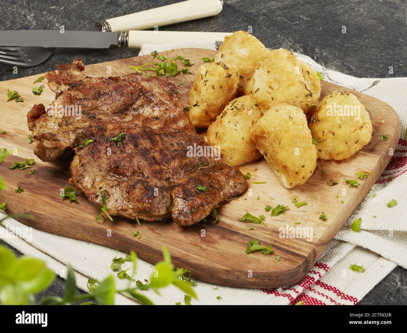 Rustic steak with potatoes Stock Photo - Alamy