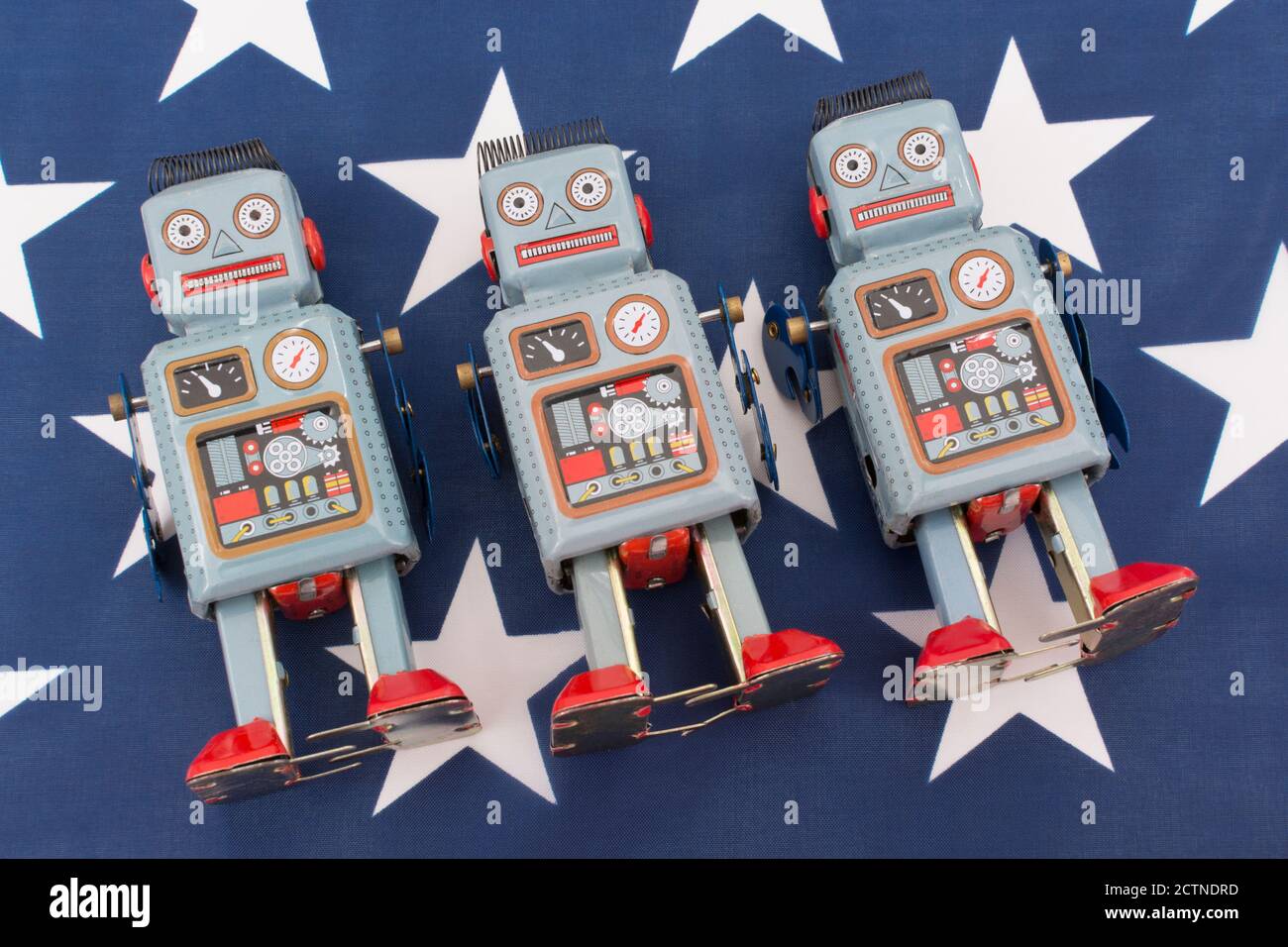 Clockwork toy robot on American flag / Stars & Stripes. For Russian ...