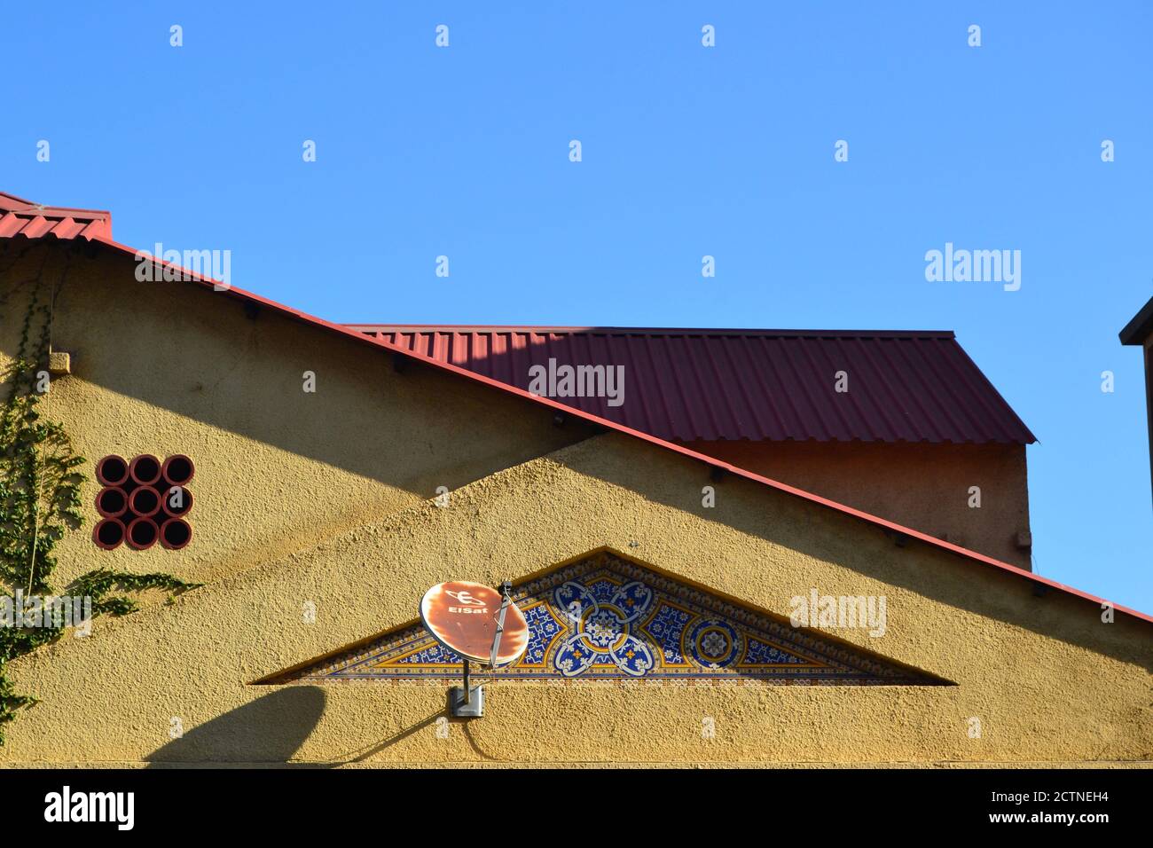 Red and yellow Maputo home Stock Photo - Alamy