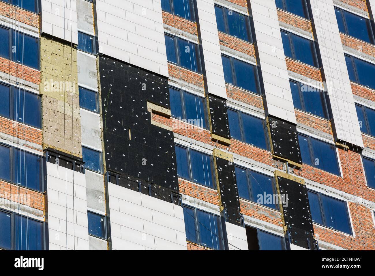 Thermal insulation of a house wall on a building site Stock Photo - Alamy
