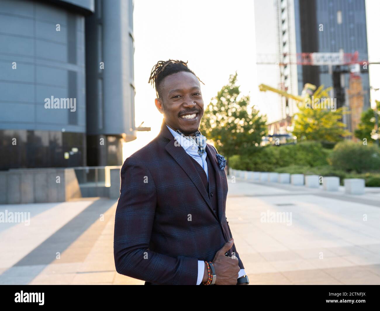 African American male entrepreneur wearing classy suit standing with ...