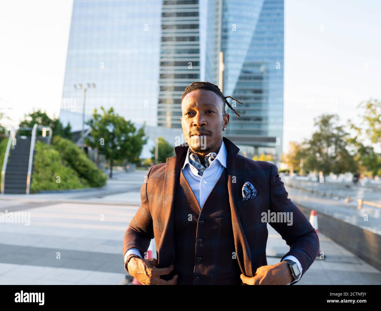 Serious African American male entrepreneur wearing classy suit standing ...