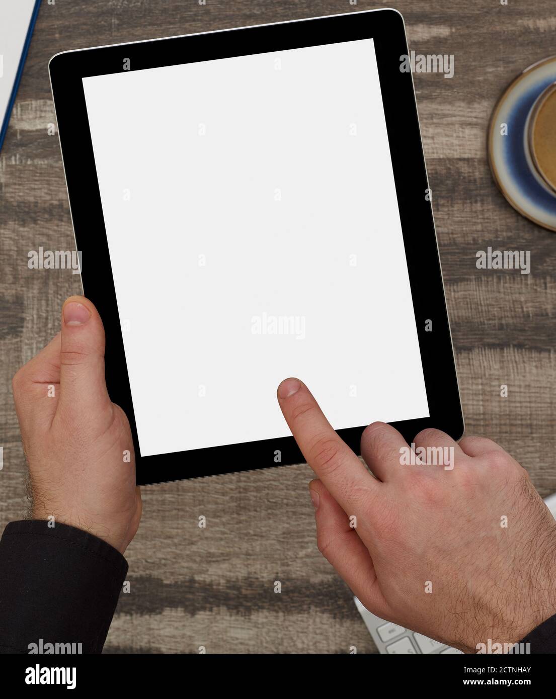 Man desk holding tablet watching hi-res stock photography and images ...
