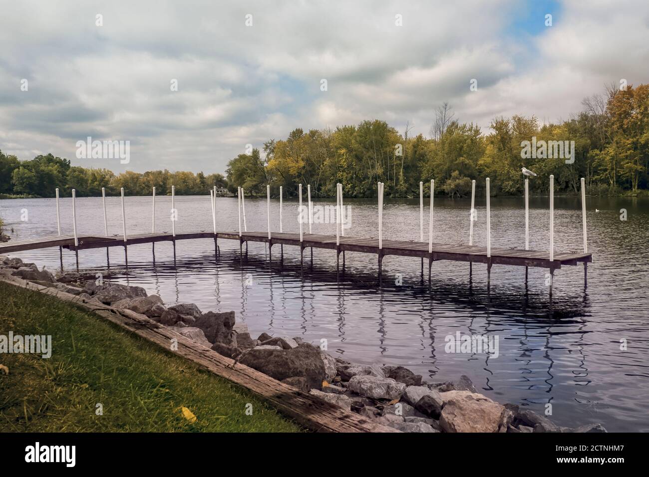 Dock on the Seneca River in Liverpool, New York on an overcast autumn ...