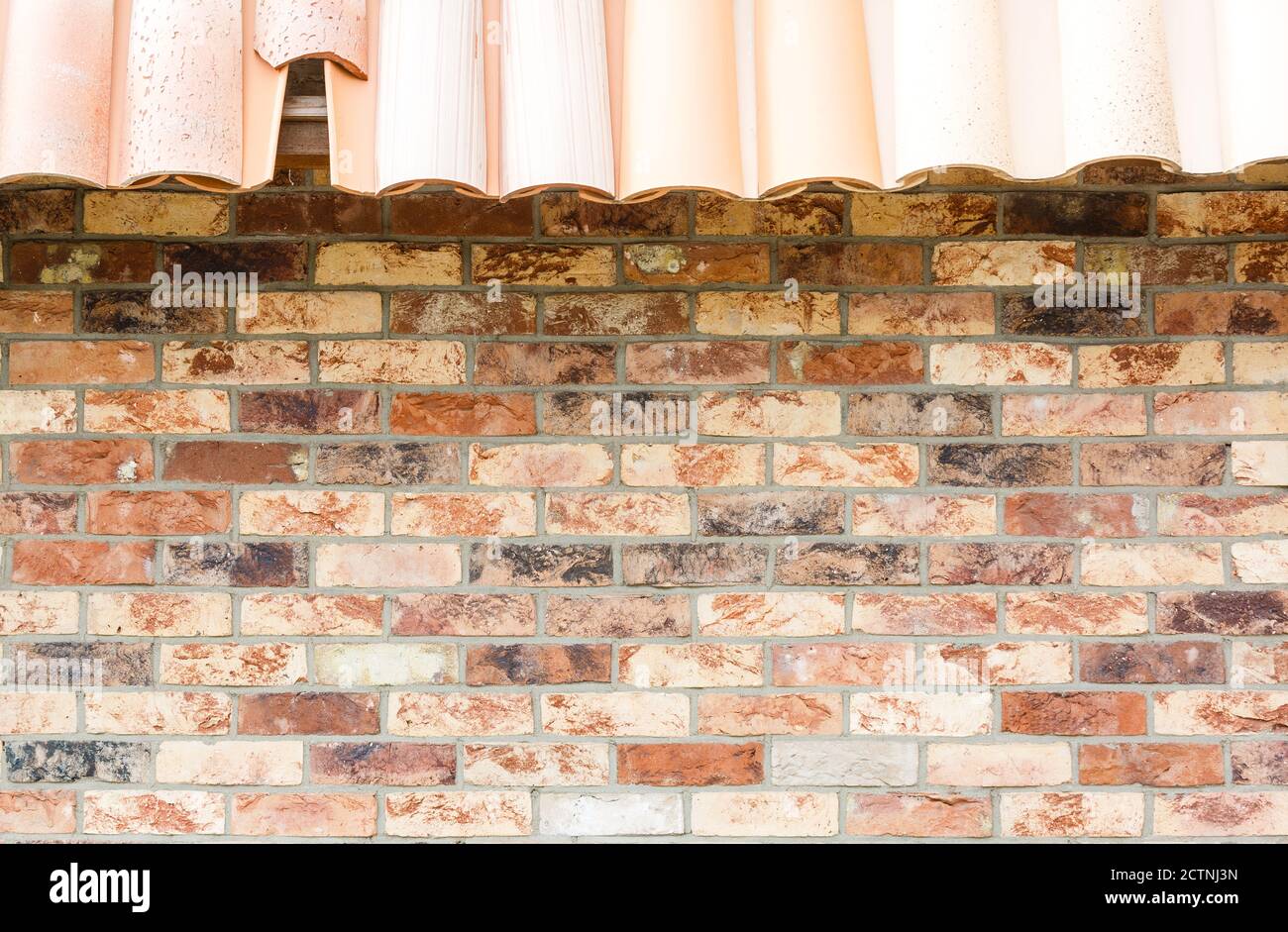 red brick wall house roof details closeup Stock Photo - Alamy