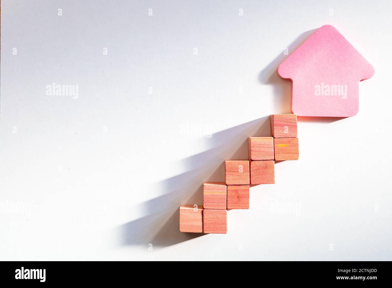 Graphic curve made with wooden boxes with house shape on the end. House ...