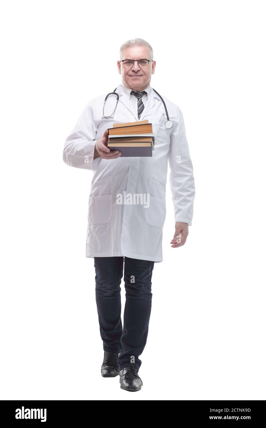in full growth. a successful doctor with a stack of books Stock Photo ...