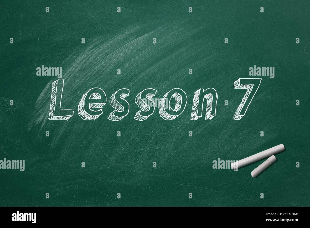 Lettering Lesson 7 on green chalkboard. Part 7 of 10 Stock Photo - Alamy