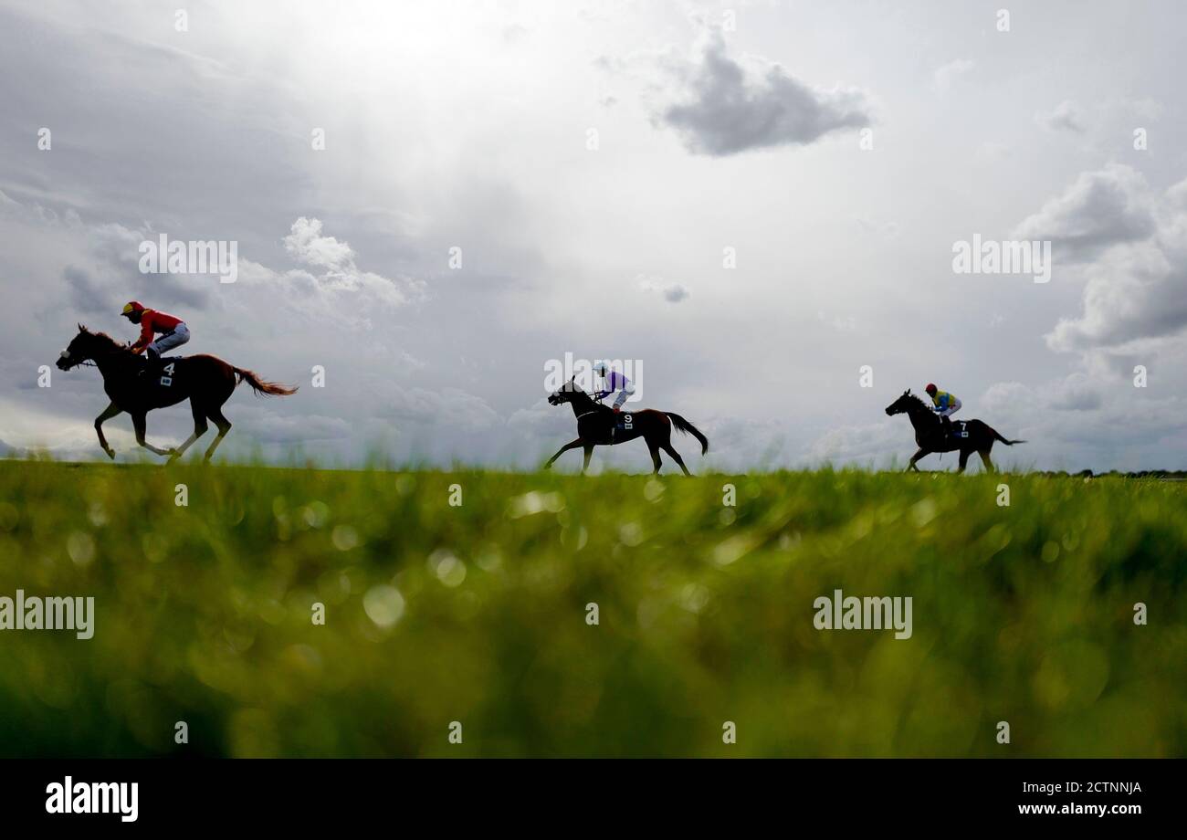 Runners ease down after finishing in The British Stallion Studs EBF ...
