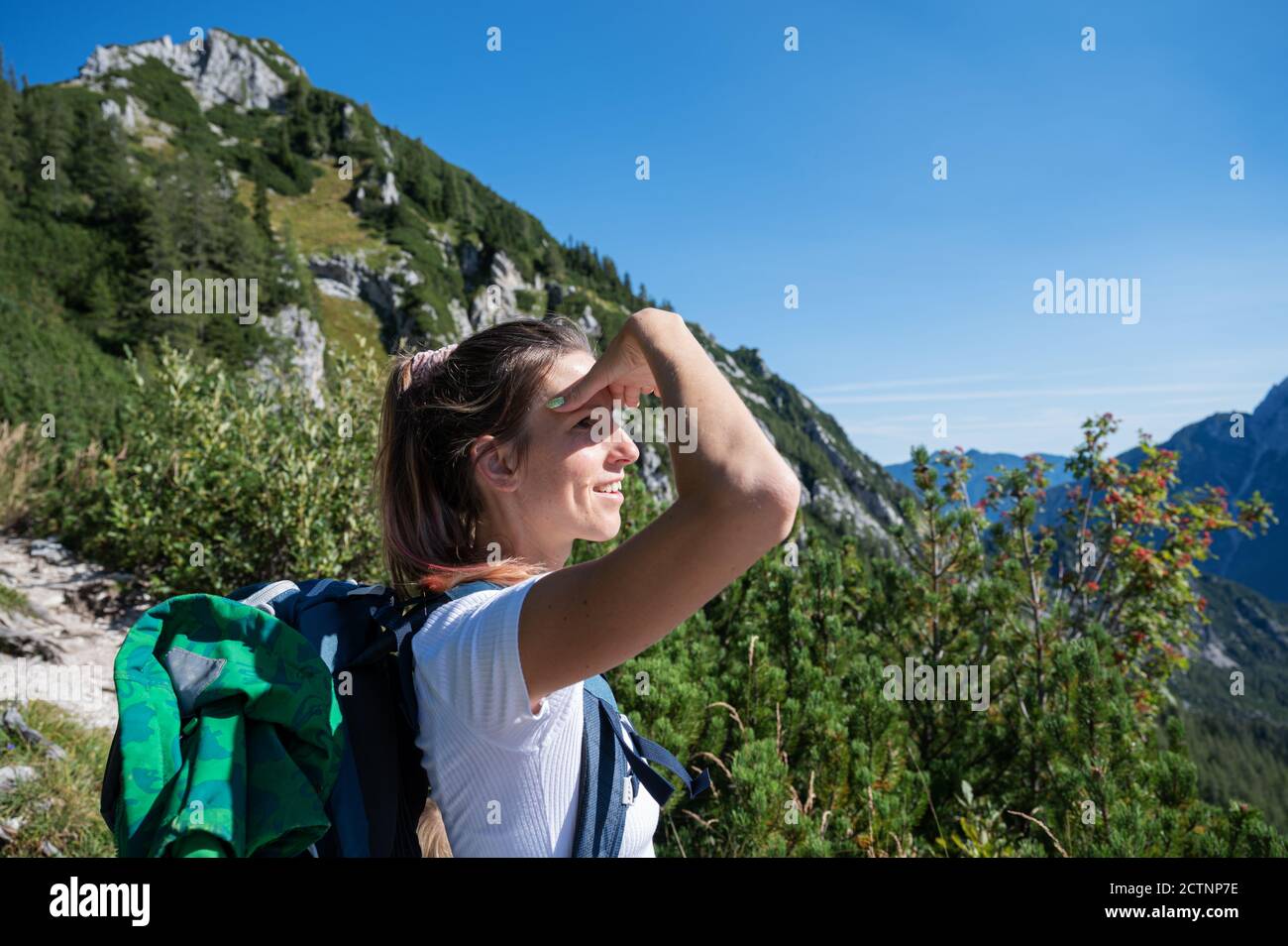 Back view young woman looking distance hi-res stock photography and ...