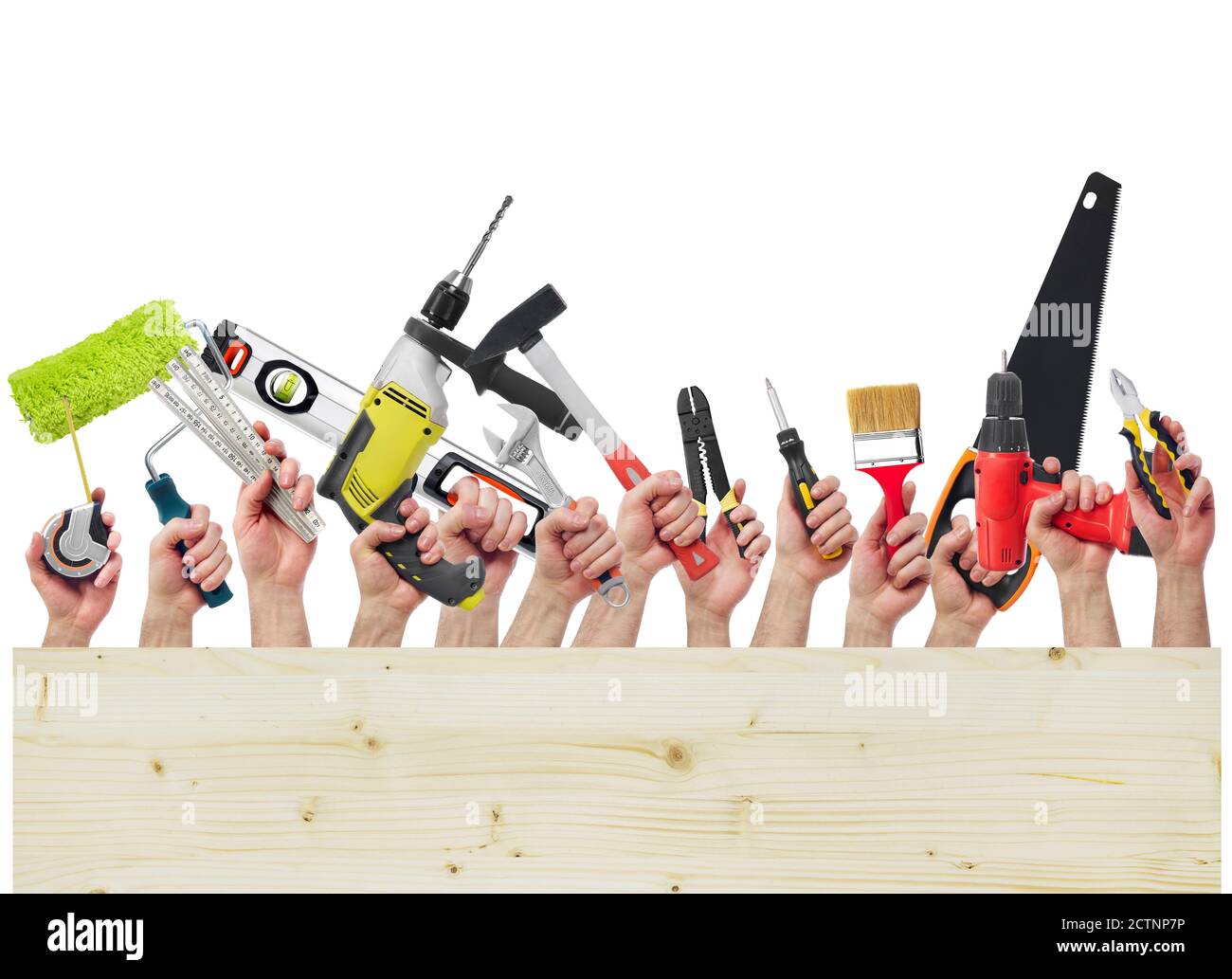 Hands raised holding different tools and wood board Stock Photo - Alamy