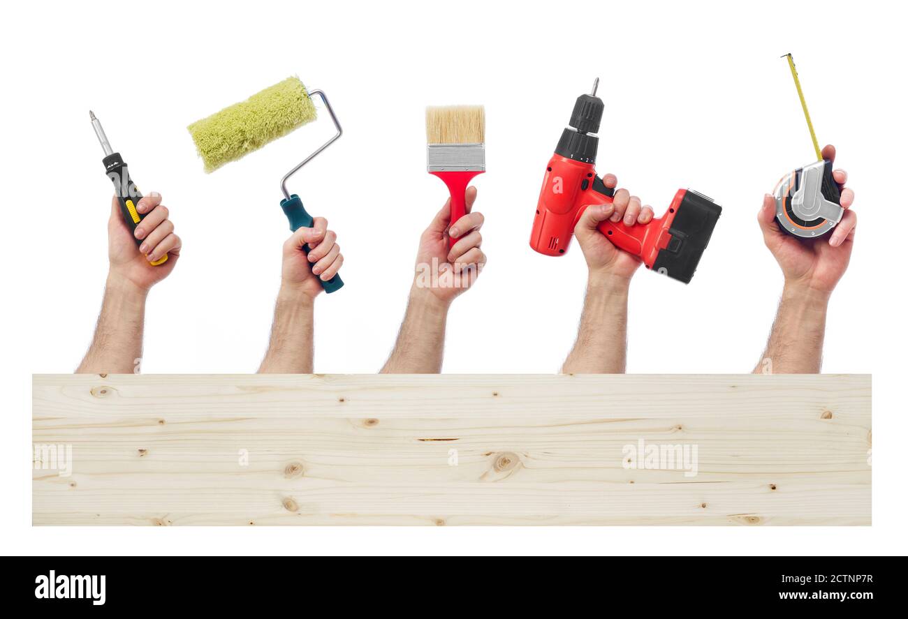 Hands raised holding different tools with copy space Stock Photo - Alamy