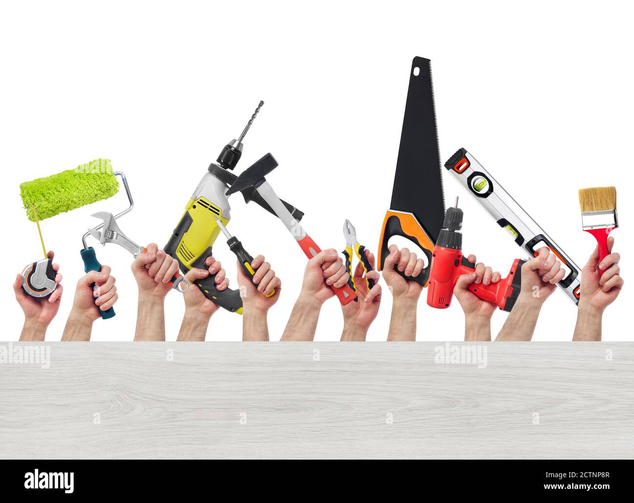 Hands raised holding different tools with copy space Stock Photo - Alamy