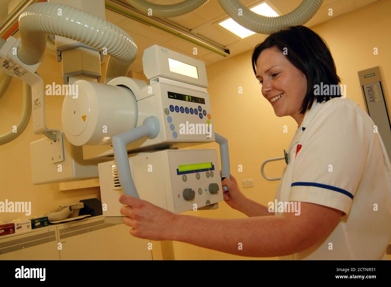 A radiographer uses new technology to take xrays of a patient at Leeds ...