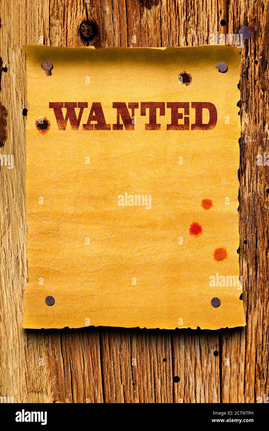 Wanted poster on wood Stock Photo - Alamy