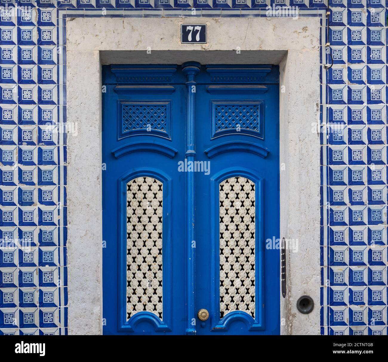 facade decorated with azulejos, hand-painted ceramic tiles, around blue ...