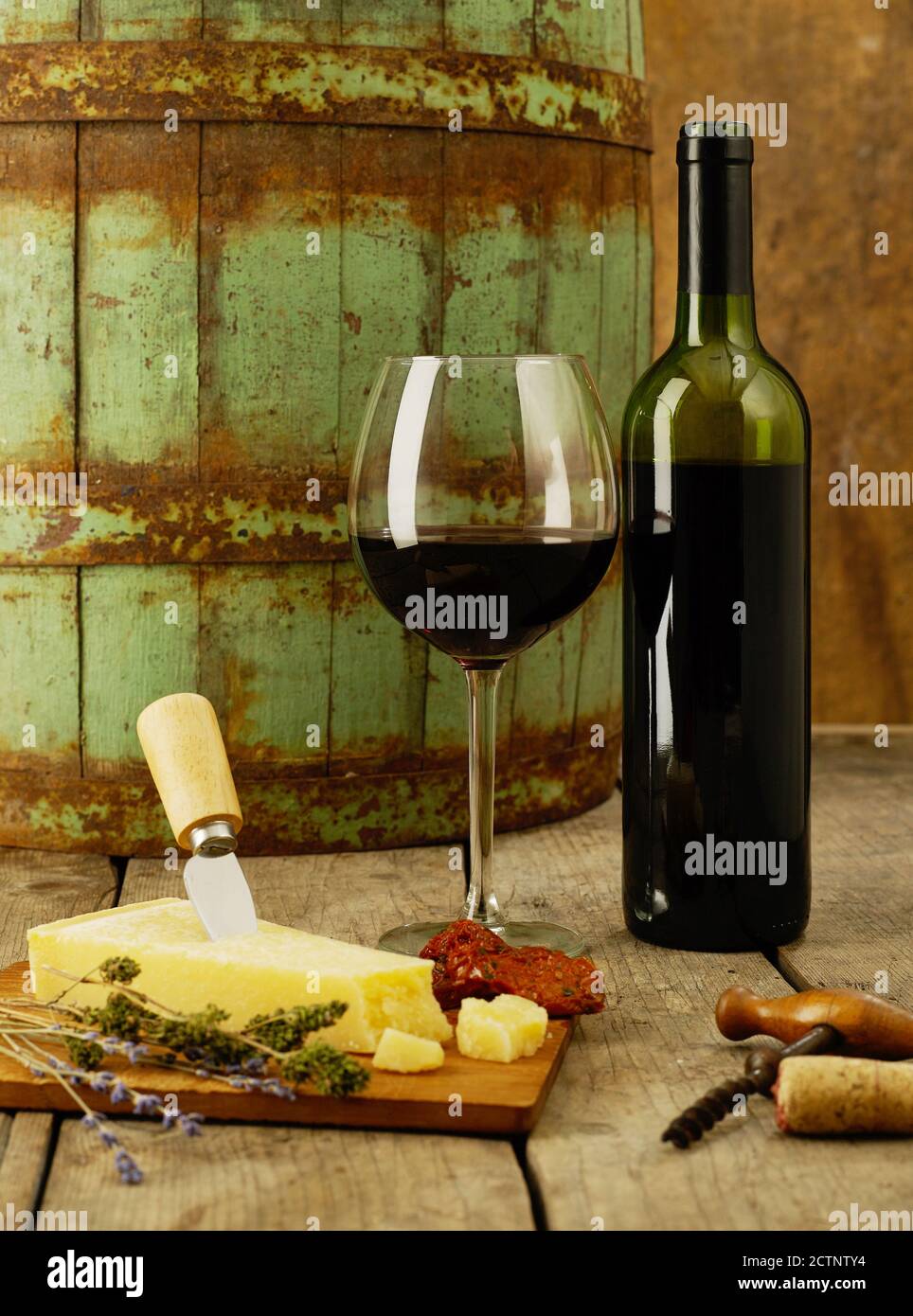 Red wine and cheddar on a rustic background Stock Photo - Alamy