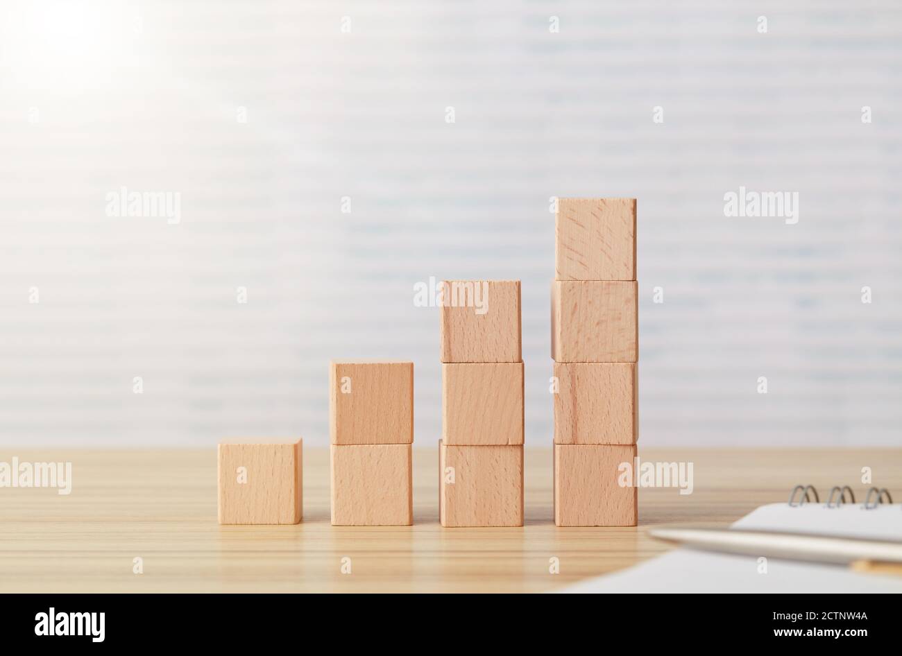 Wooden cubes on office desk Stock Photo - Alamy