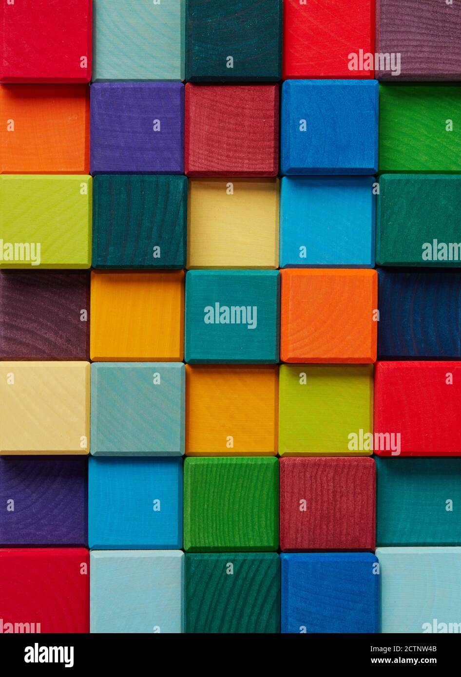 Multi-colored wooden toy blocks background Stock Photo - Alamy