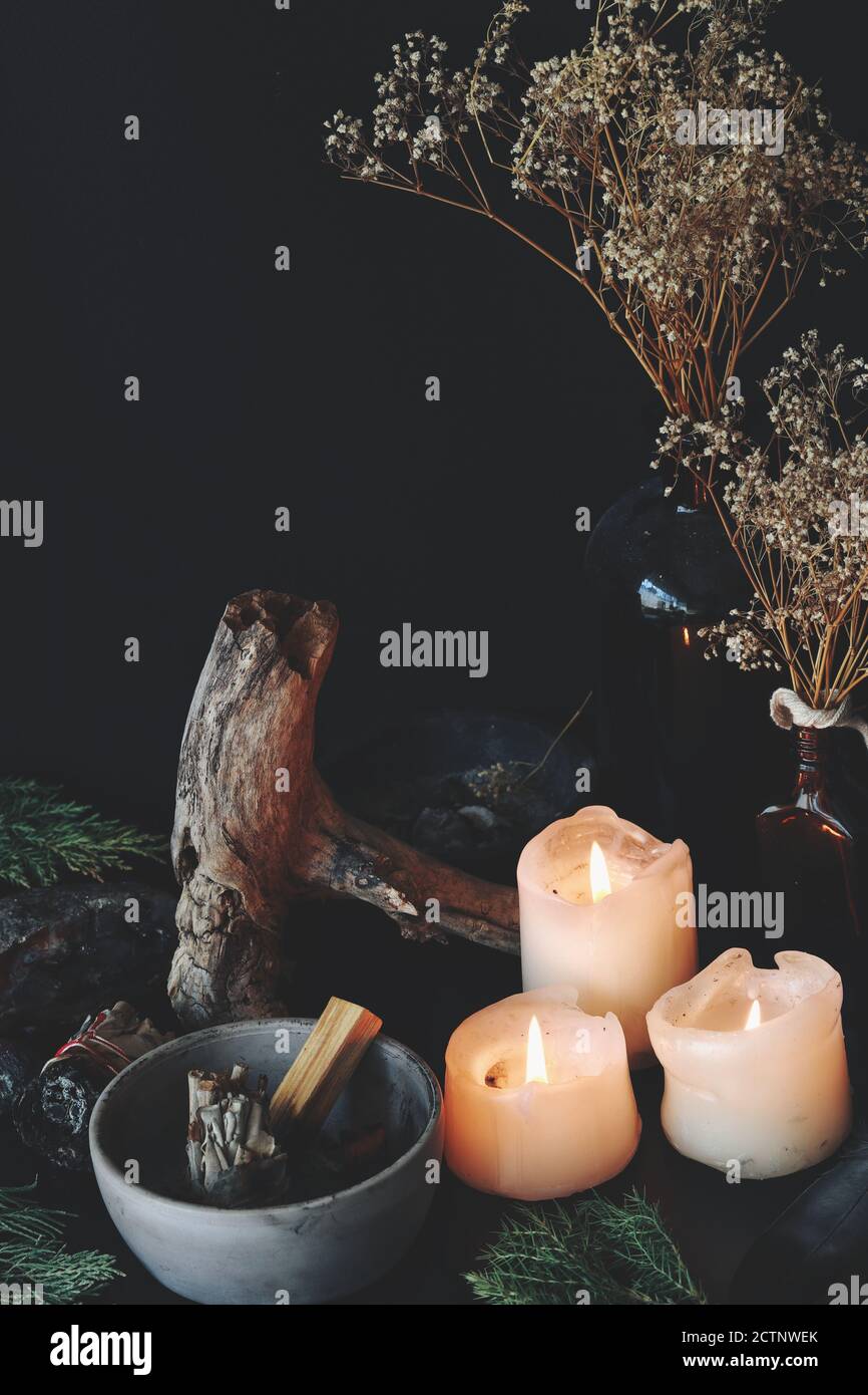 Wiccan witch altar prepared for casting a spell. Dark black night time ...