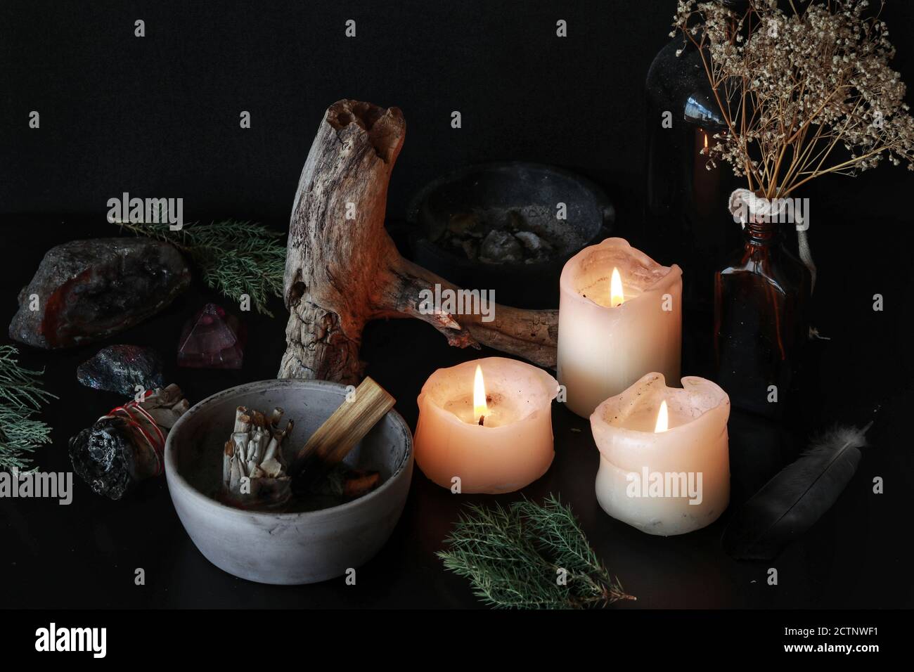 Wiccan witch altar prepared for casting a spell. Dark black night time ...