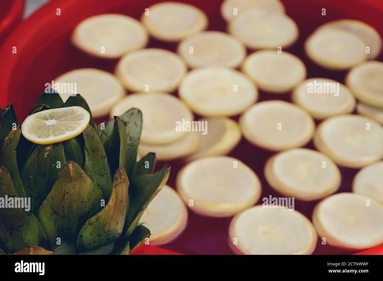 fresh organic artichoke flower and artichoke hearts (cardoon) ready for ...