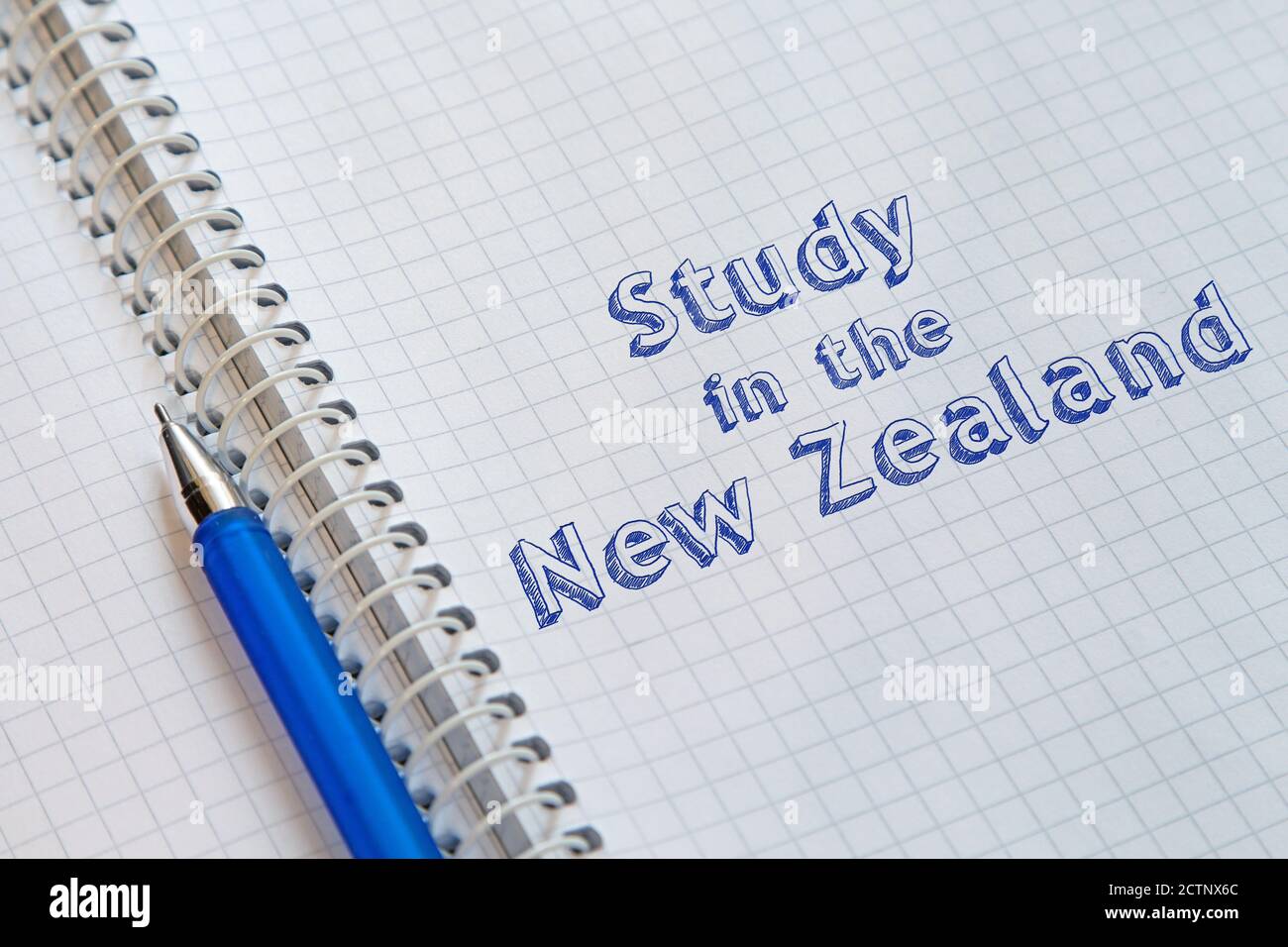 Text Study in New Zealand handwritten on sheet of notebook Stock Photo ...