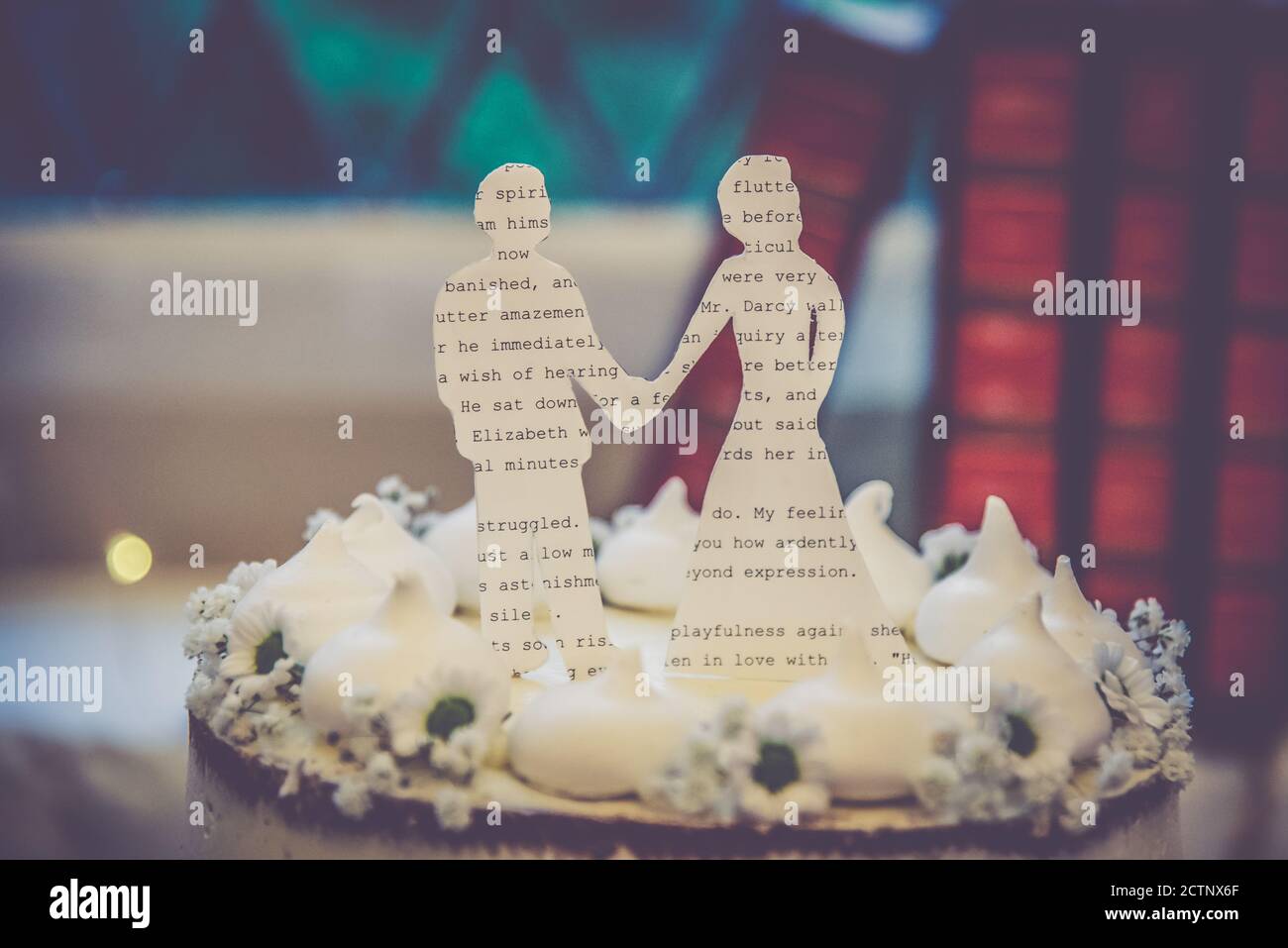 Cut out cake toppers from the couples favorite books Stock Photo - Alamy