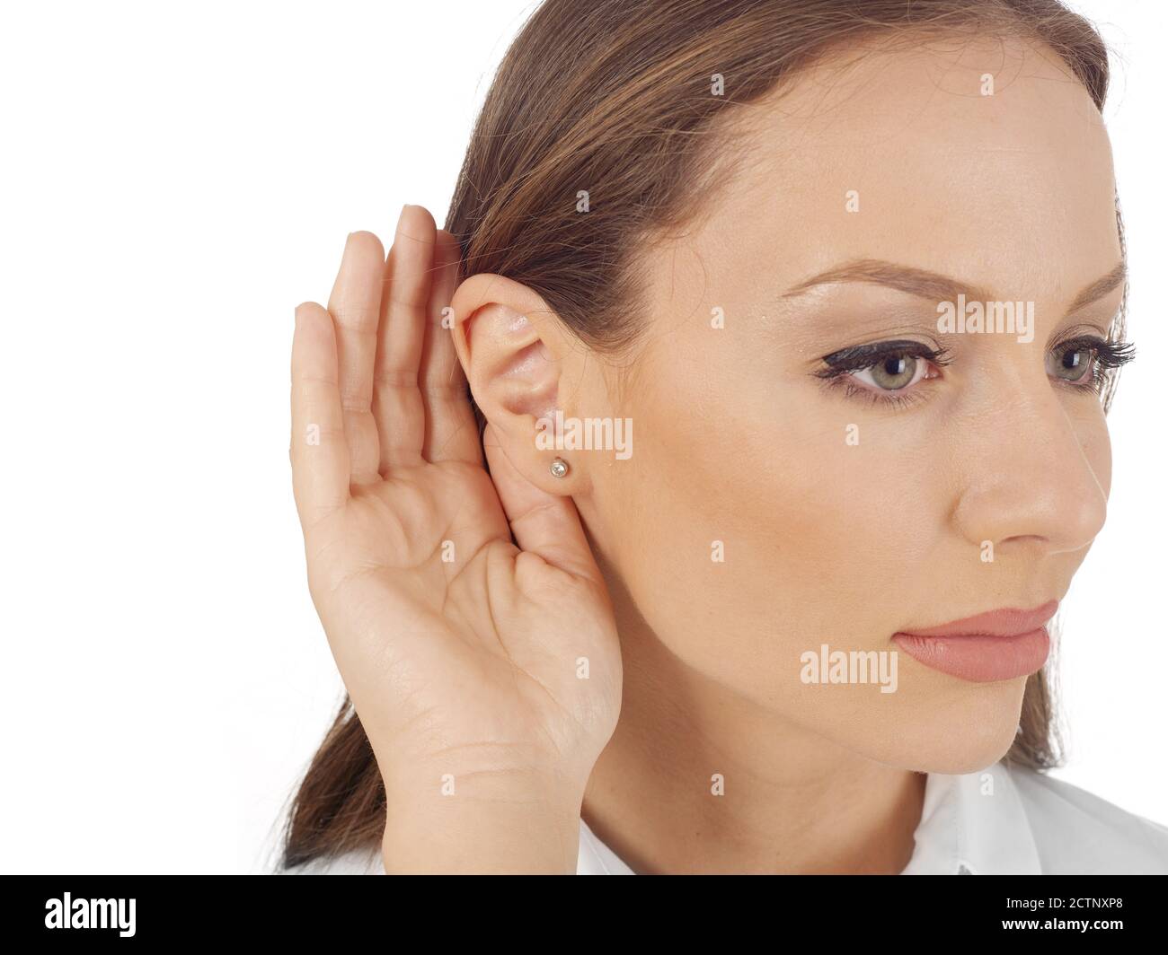 Woman listening, white background Stock Photo - Alamy