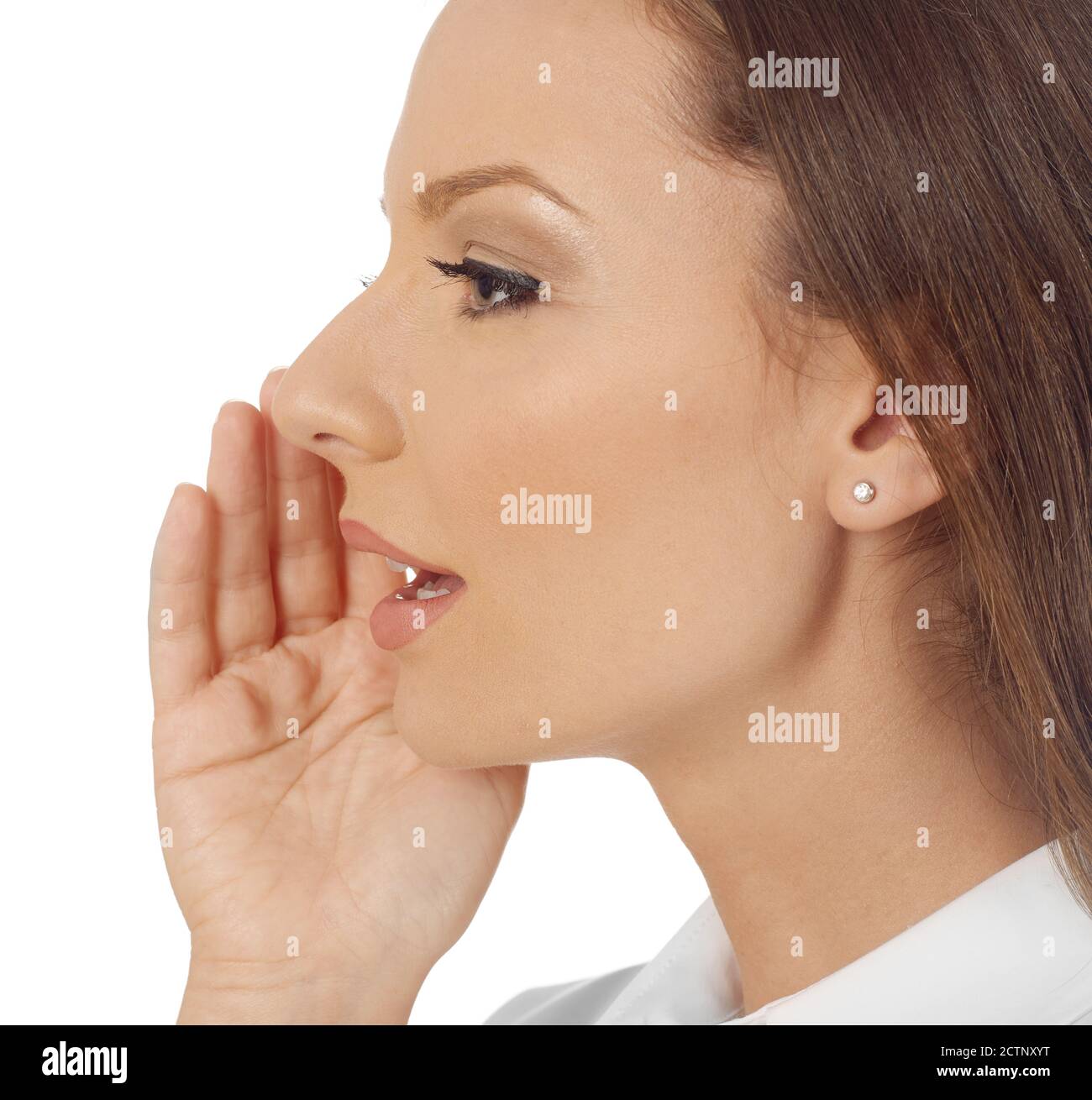Woman telling a secret, white background Stock Photo - Alamy