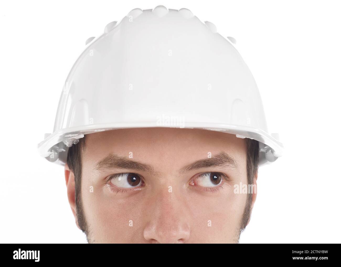 Worker's head with hardhat looking Stock Photo - Alamy