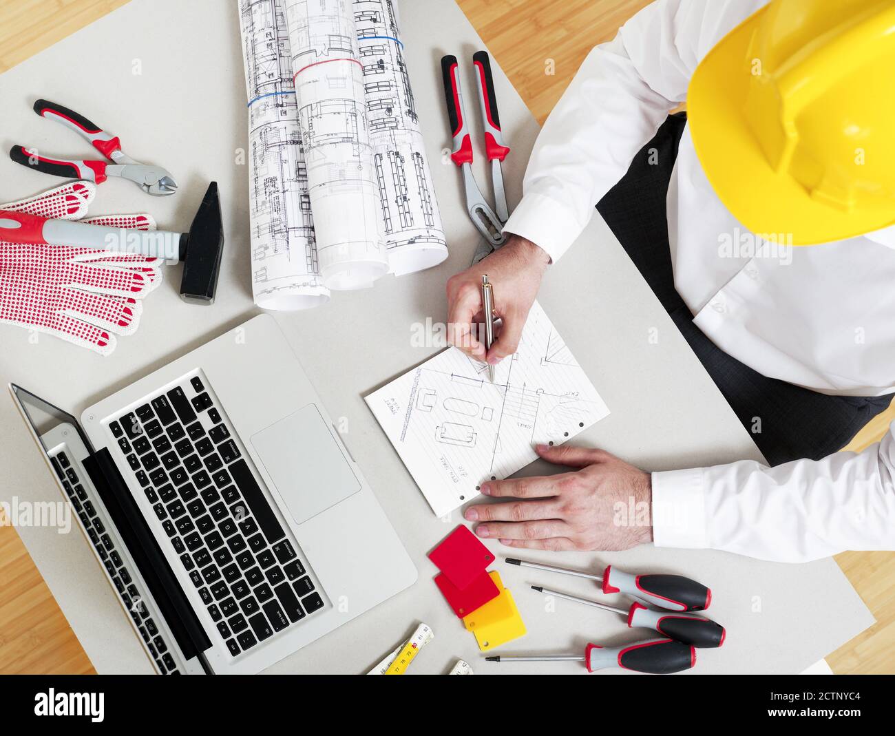 Building contractor working on sketches Stock Photo - Alamy