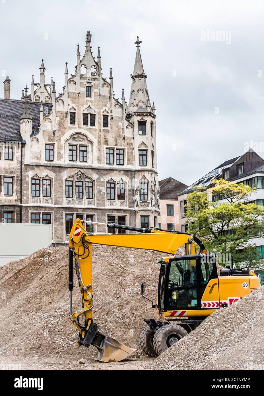 Construction equipment against the background of a medieval Gothic ...
