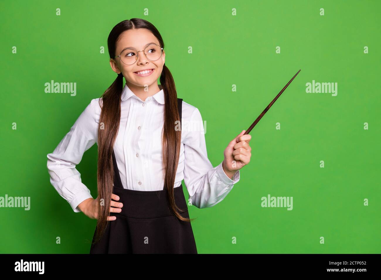 Photo of pretty lovely small lady in front of blackboard hold pointer ...