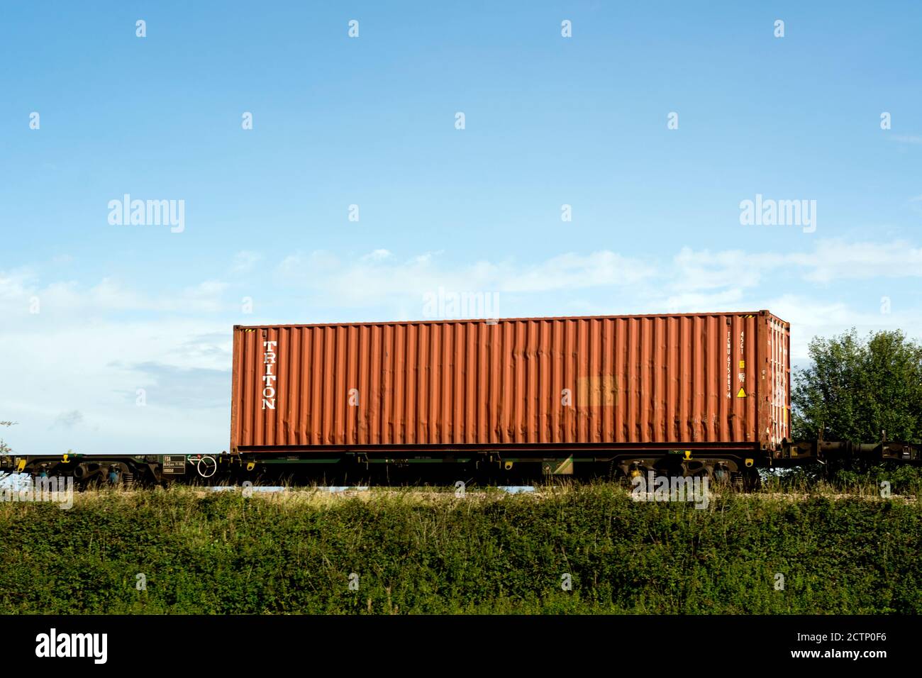 Triton shipping container on a freightliner train, Warwickshire, UK ...
