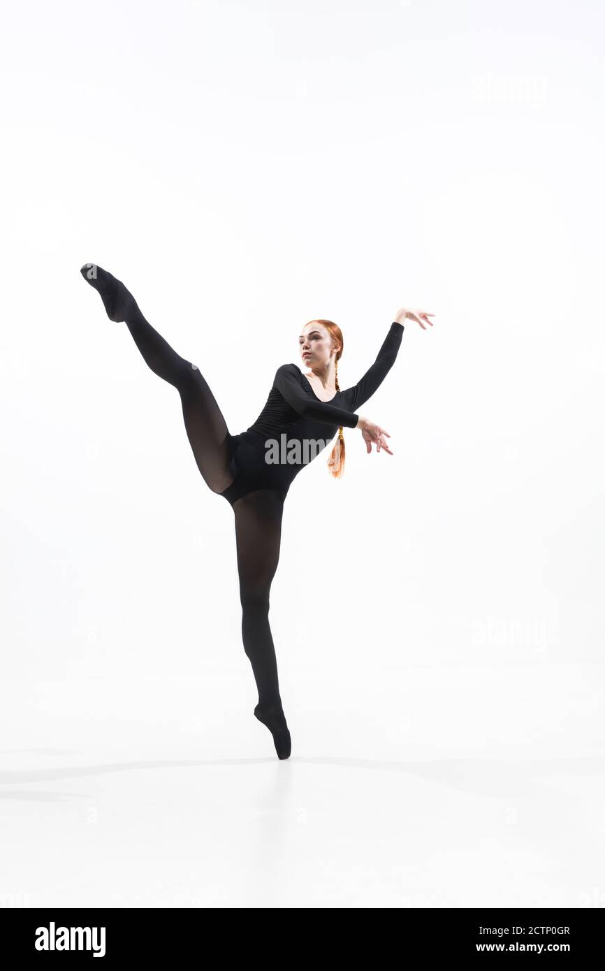 Weightless. Young and graceful ballet dancer in minimal black style ...
