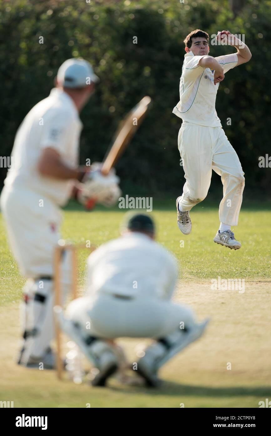 Bowler in action Stock Photo - Alamy