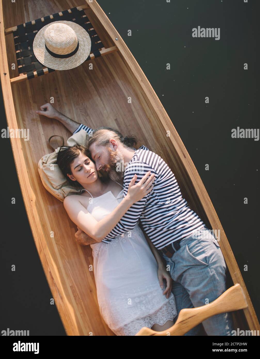 Couple relaxing in the canoe Stock Photo - Alamy