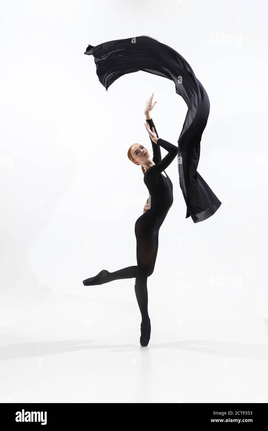 Lines. Young and graceful ballet dancer in minimal black style isolated ...