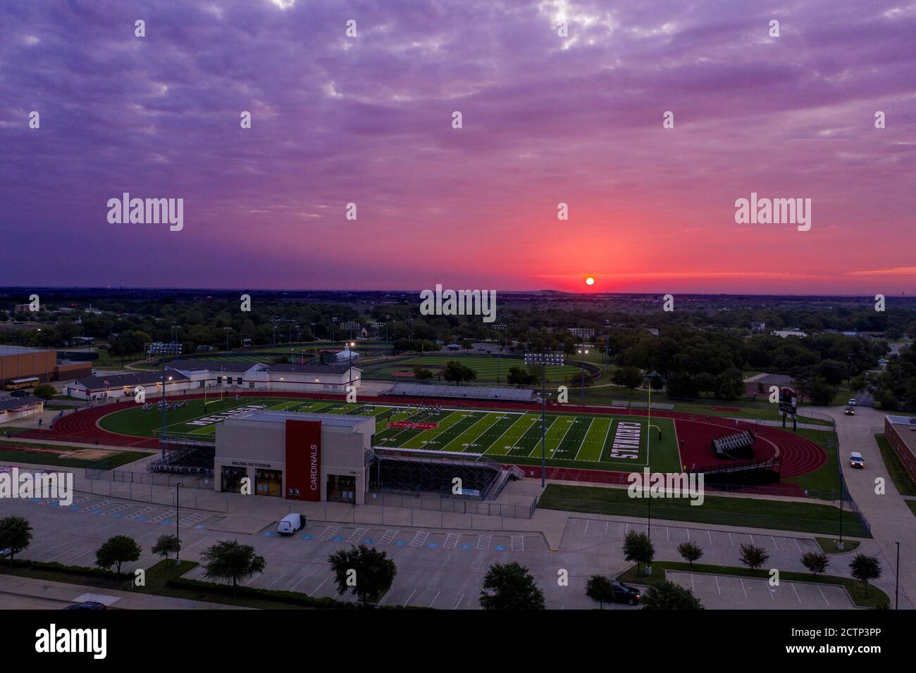High School Football Stadium with Purple Sunset Stock Photo - Alamy