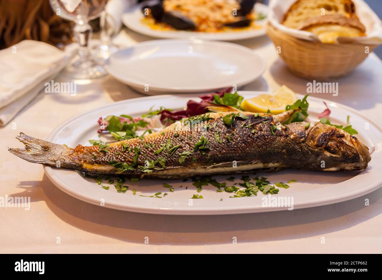 ROME, ITALY - 2014 AUGUST 18. Fried whole fish on a dish in Rome Stock ...