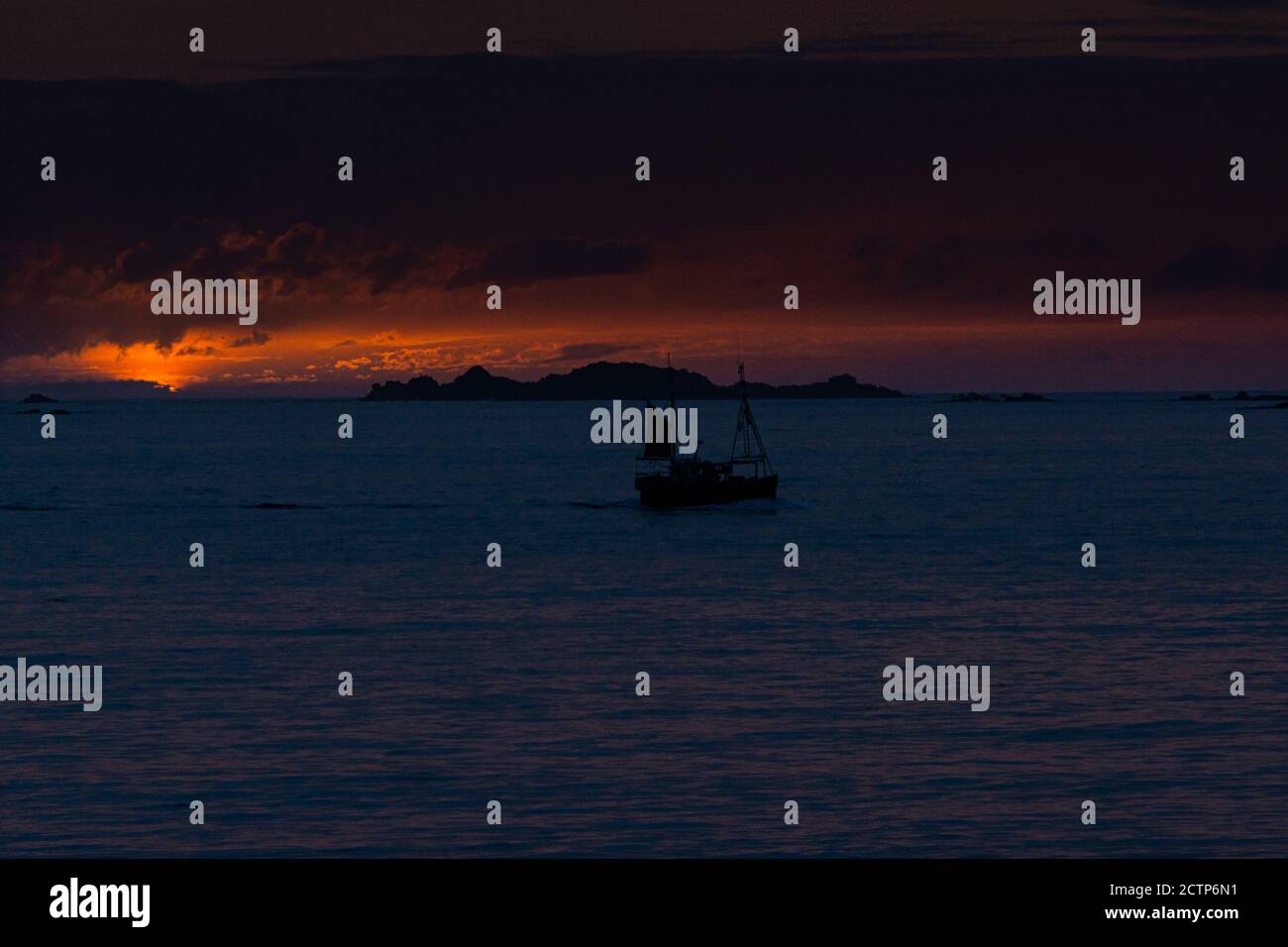 A boat in the Isles of Scilly at sunset Stock Photo - Alamy