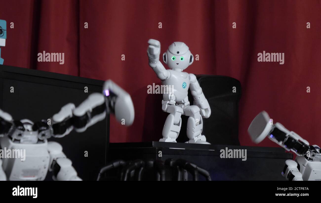 Humanoid robot dance. Group of cute robots dancing Stock Photo - Alamy